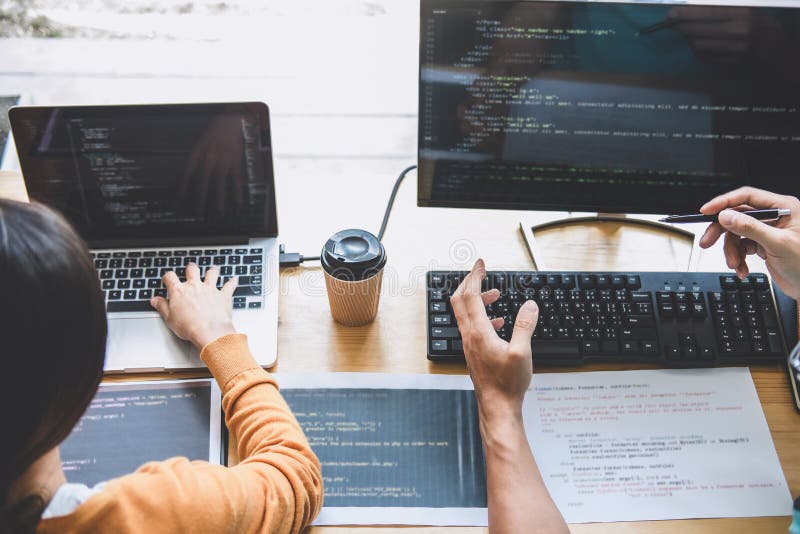Programmers Cooperating At Developing Programming And Website Working In A Software Develop