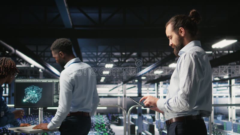 Programmers on Data Center Industrial Platform Checking Code on Tablet Stock Video - Video of ...