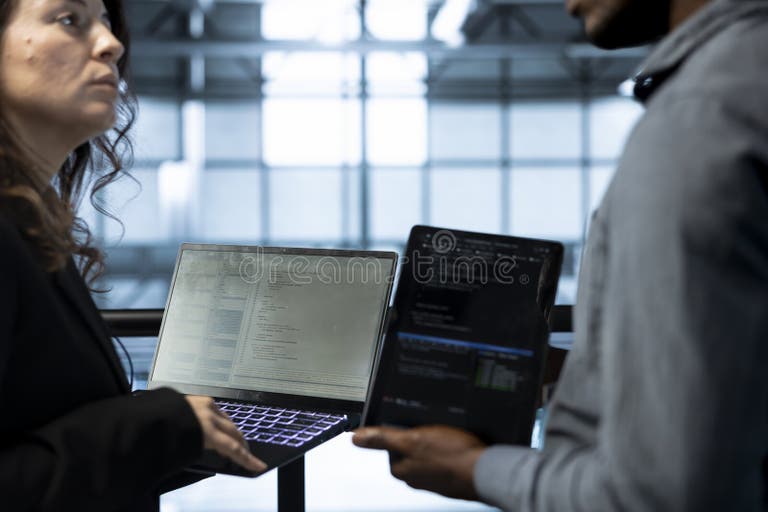 Programmers in Data Center Using Devices, Executing Security Patches Stock Image - Image of ...