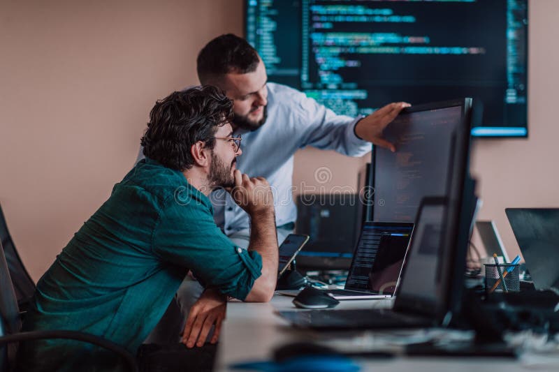 Programmers Engrossed in Deep Collaboration, Diligently Working ... Programmers Engrossed in Deep Collaboration, Diligently Working ...