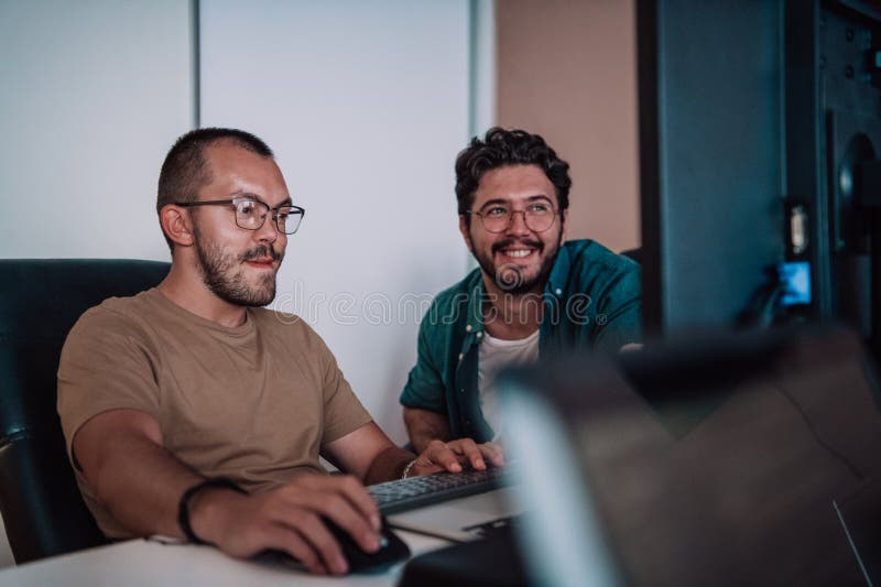 Programmers Engrossed in Deep Collaboration, Diligently Working ...