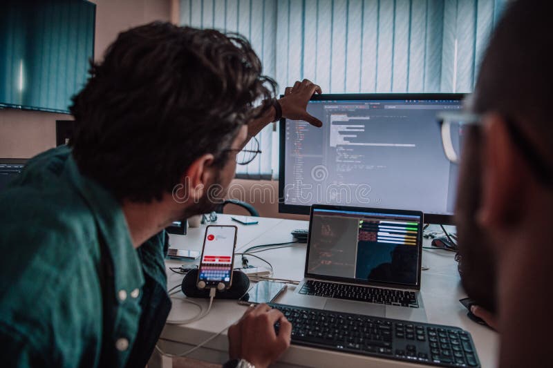Programmers Engrossed in Deep Collaboration, Diligently Working ... Programmers Engrossed in Deep Collaboration, Diligently Working ...