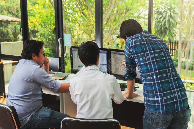 Programmers Team Working in a Software Developing. Developing ... Programmers Team Working in a Software Developing. Developing ...