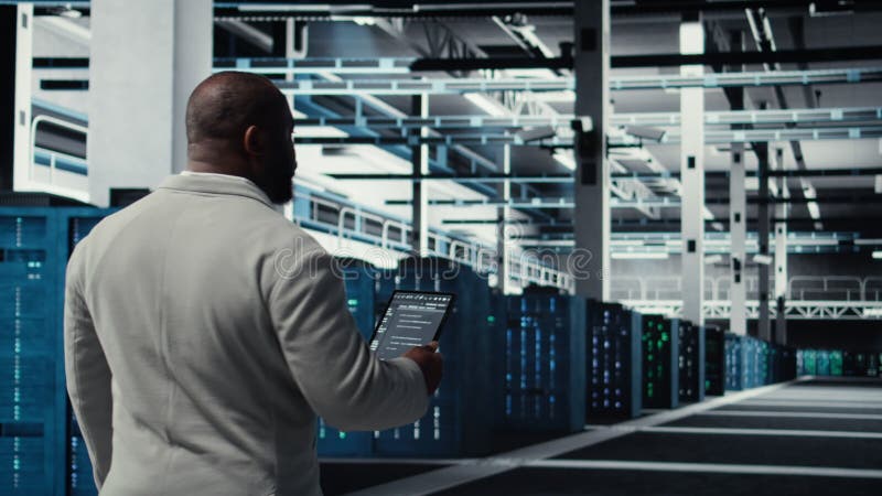 Programmers Walking in Data Center Coding, Doing Optimizations Using ...