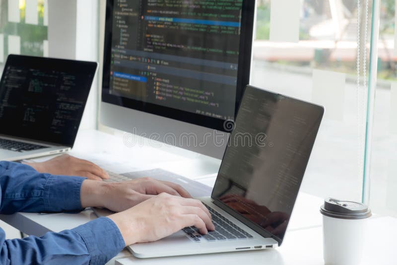 Programmers Work On The Development Of Coding And Coding Technology On White Desks And Website