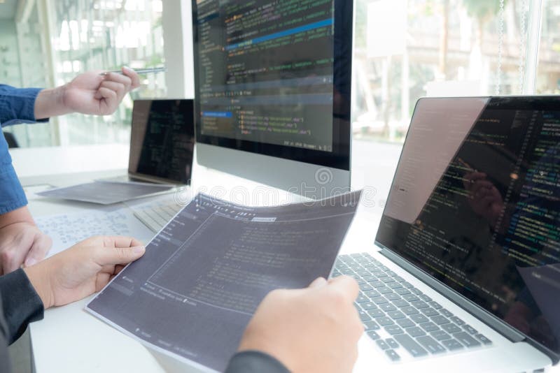 Programmers Work on the Development of Coding and Coding Technology on White Desks and Website ...