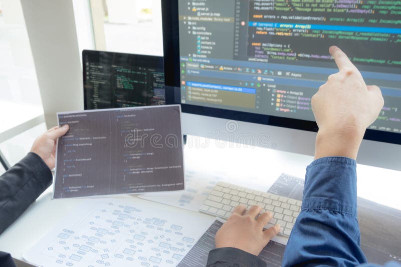 Programmers Work on the Development of Coding and Coding Technology on White Desks and Website ...