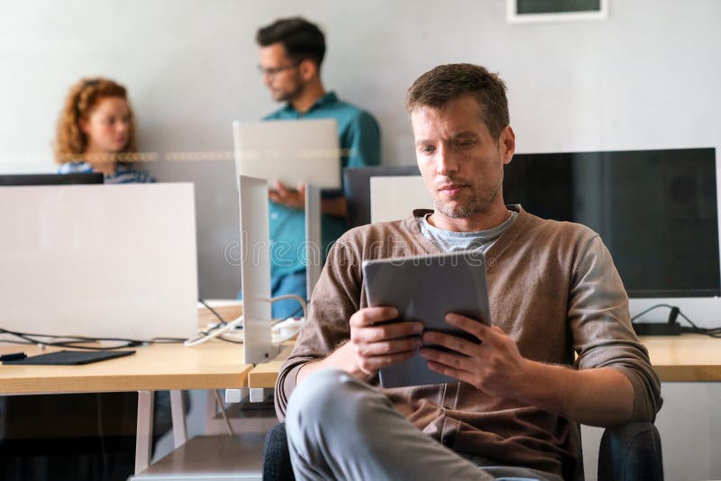 Programmers Working in a Software Developing Company Office Stock Photo ...