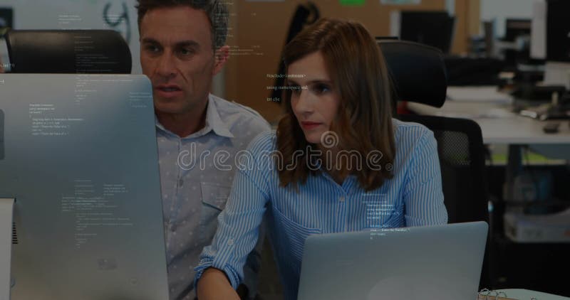 Programming Code Animation Over Two Colleagues Working on Computers in Office Stock Video ...