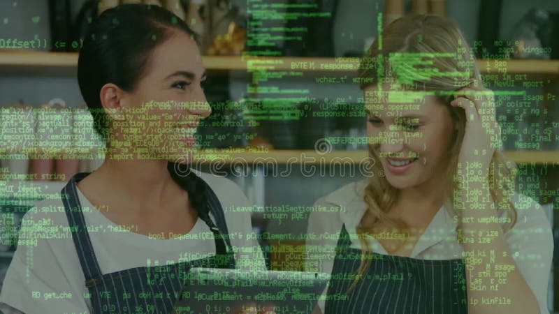 Programming Code Animation Over Two Women in Aprons Smiling in Kitchen ...