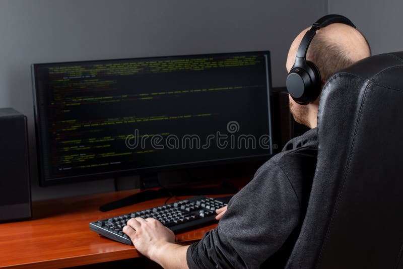 Programming. a Man Working on a Computer in it at Home, Sitting at a ...