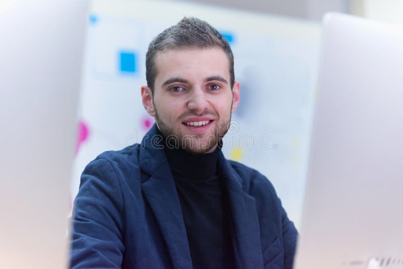 Programming Man Working On Computer In It Office Sitting At Desk