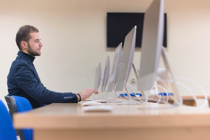 Programming. Man Working on Computer in it Office, Sitting at Desk Writing Codes. Programmer ...