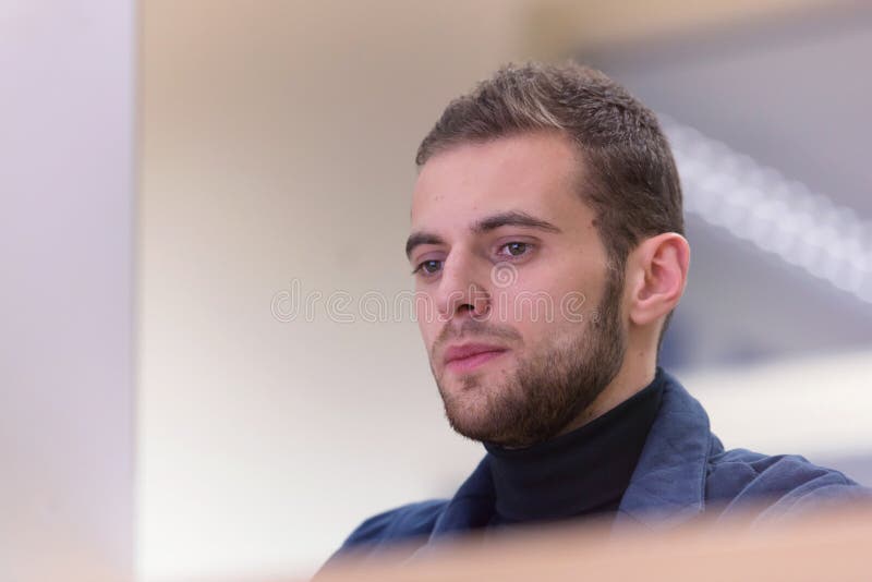 Programming Man Working On Computer In It Office Sitting At Desk