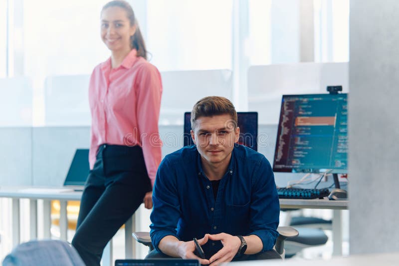 Programming Man Working On Computer In It Office Sitting At Desk Writing Codes Stock Image