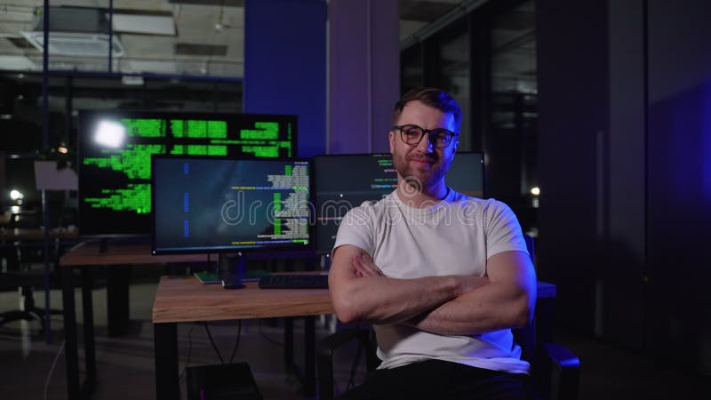 Portrait of Programmer in Dark it Office, Sitting at Desk Stock Footage ... Portrait of Programmer in Dark it Office, Sitting at Desk Stock Footage ...