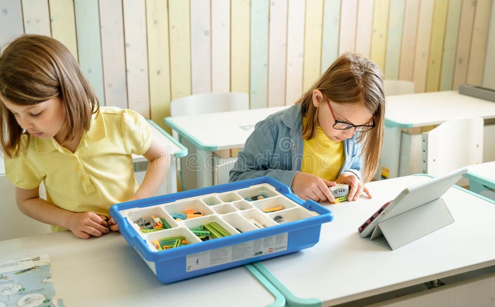 Programming Work, Learning Robotics in Elementary School. Children Students Assembly, Launch ...