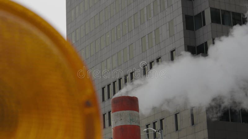 Steam Vents from a Construction Pipe with a Foreground of a Warning ...