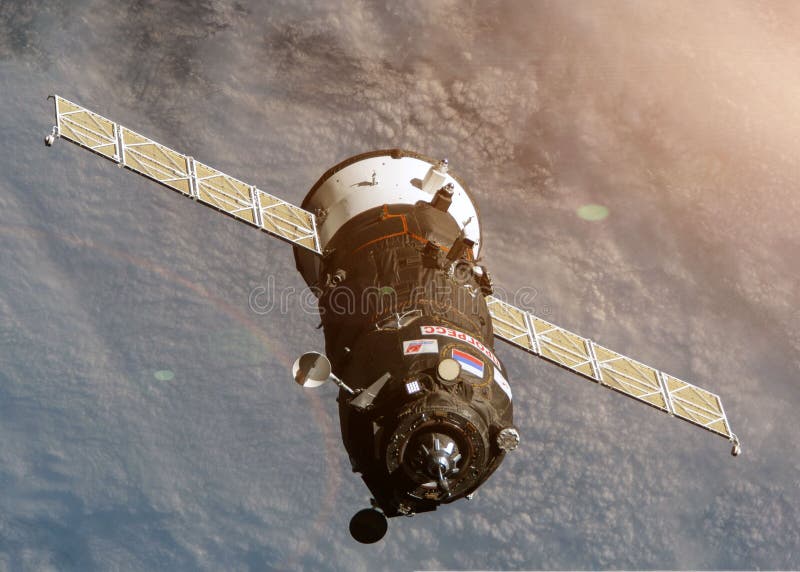 The Progress Spacecraft is Piloted by Astronauts in Orbit of Planet ...