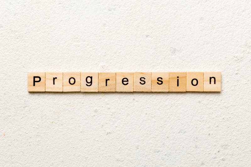 Progression Word Written on Wood Block. Progression Text on Cement ...