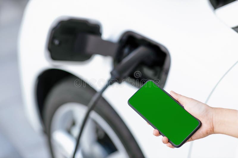 Progressive Concept of Green Screen Mockup Phone, EV Car and Charging ... Progressive Concept of Green Screen Mockup Phone, EV Car and Charging ...