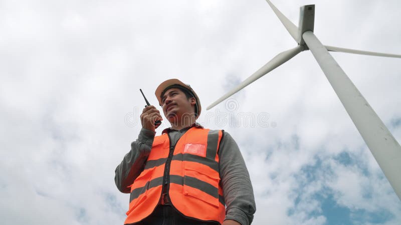 Progressive Engineer Working with the Wind Turbine, with the Sky As ...