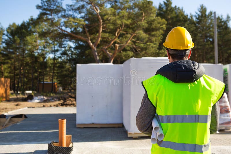 The Back of Construction Worker Wearing Safety Harness and Safety Line ...