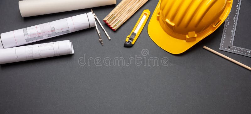 Project Blueprints, Yellow Hardhat and Engineering Tools on Black Stock ...