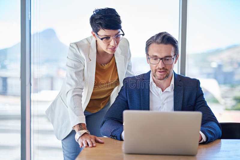 This Project is really Coming Together. Two Colleagues Working on a ...