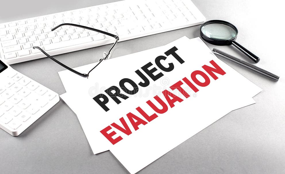 PROJECT EVALUATION Text on a Paper with Keyboard, Calculator on Grey ...
