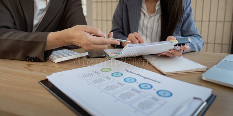 Project Management Discussion. Team Members Analyzing Project Details ...