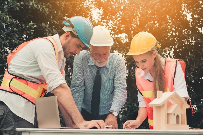 Project Management Team of Engineers and Architects Discussing a Stock ...