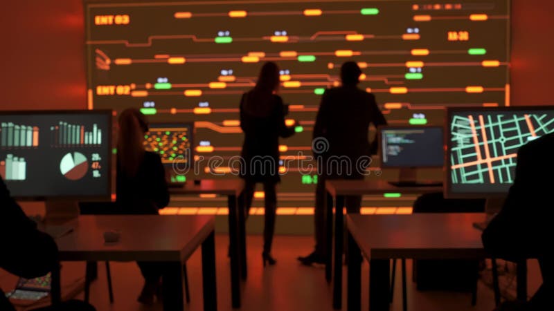 Technical Support Team in Control Room. Man and Woman Specialists ...