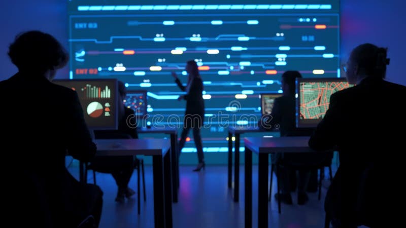 Technical Support Team in Control Room. Woman Leader Specialist Talking ...