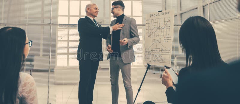 Project Manager Congratulating the Best Employee at a Meeting with the ...