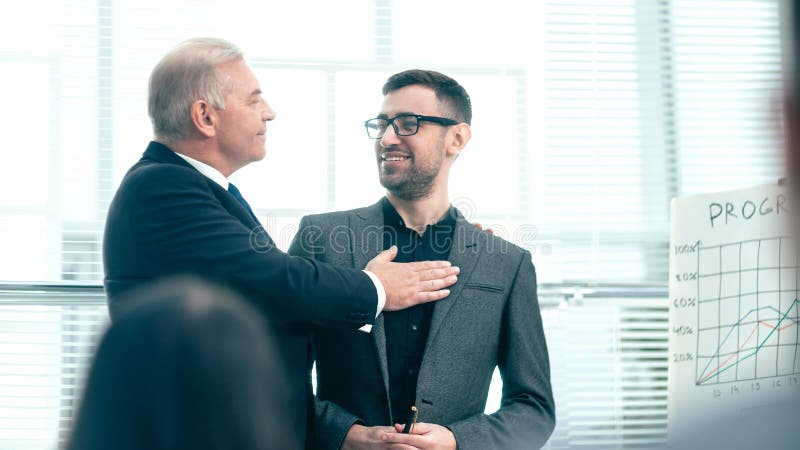 Project Manager Congratulating the Best Employee at a Meeting with the ...