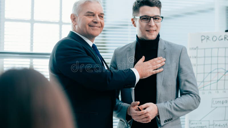 Project Manager Congratulating the Best Employee at a Meeting with the ...