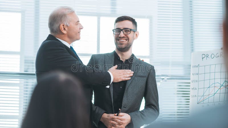 Project Manager Congratulating the Best Employee at a Meeting with the ...