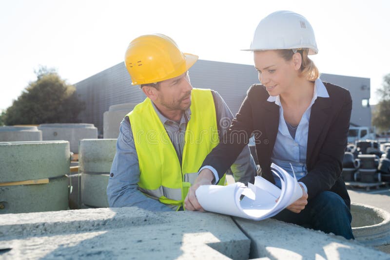 Project-manager and Contractor Looking at Blueprints Stock Photo ...