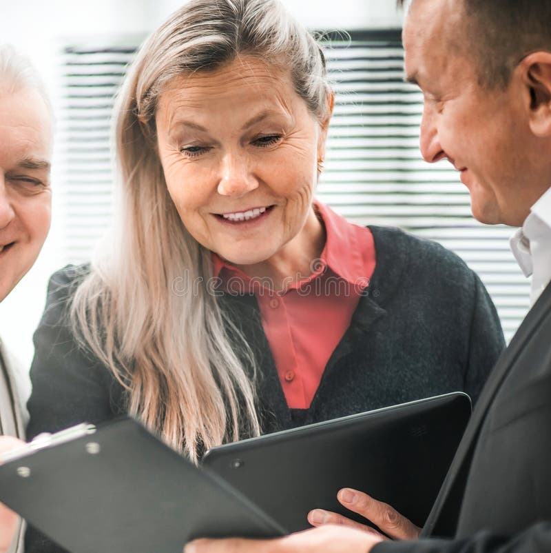 Project Manager Discussing Working Documents with Colleagues Stock ...