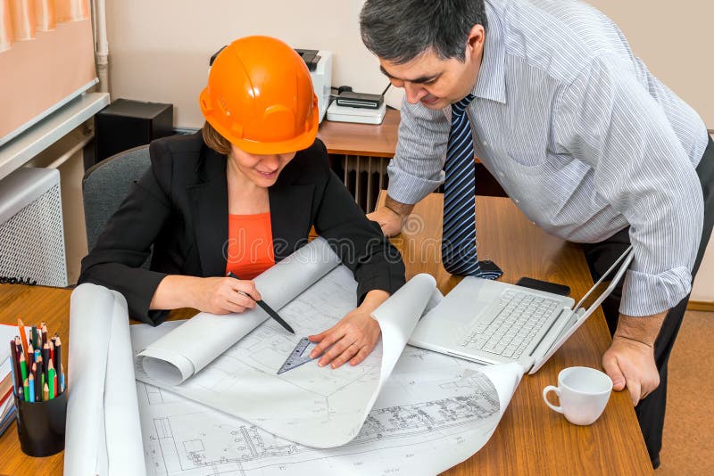 Project Manager and Engineer Discussing Building Plans Stock Image ...