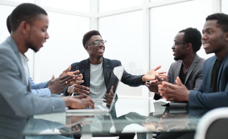 Project Manager Explaining Something To Employees at an Office Meeting ...