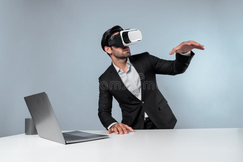 Project Manager Looking by Using VR Goggle while Sitting at Laptop ...