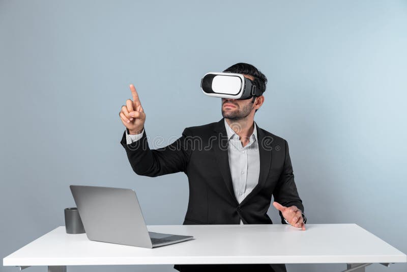 Project Manager Looking by Using VR Goggle while Sitting at Laptop ...