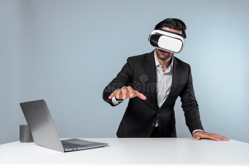 Project Manager Looking by Using VR Goggle while Sitting at Laptop ...