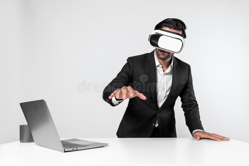Project Manager Looking by Using VR Goggle while Sitting at Laptop ...