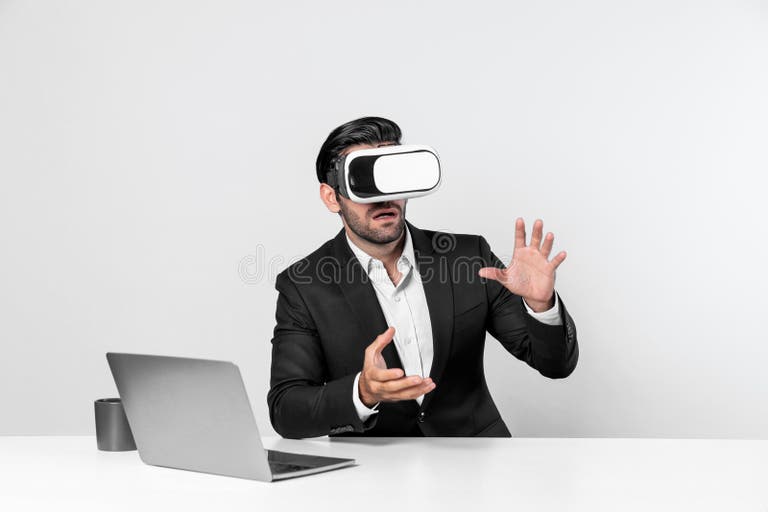 Project Manager Looking by Using VR Goggle while Sitting at Laptop ...