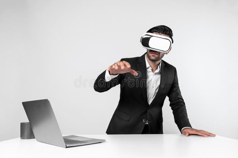 Project Manager Looking by Using VR Goggle while Sitting at Laptop ...