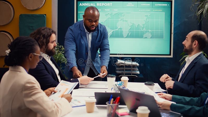 Project Manager Meeting with His Executive Team in a Boardroom Office ...