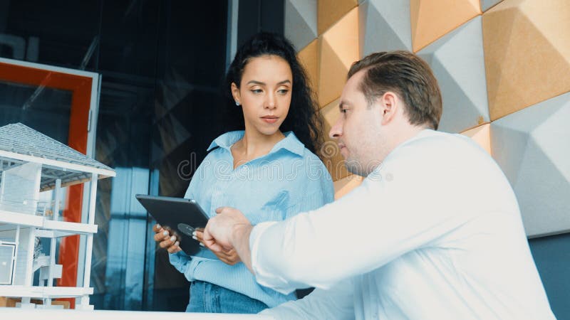 Project Manager Pointing and Discussion about Building Design ...